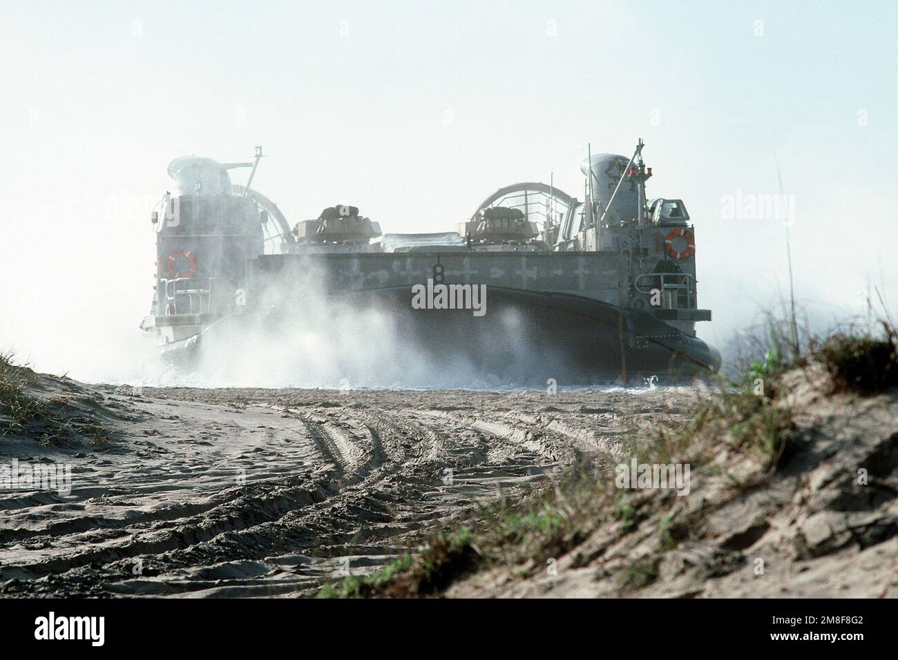 The air cushion landing craft LCAC-8 comes ashore at Onslow Beach ...