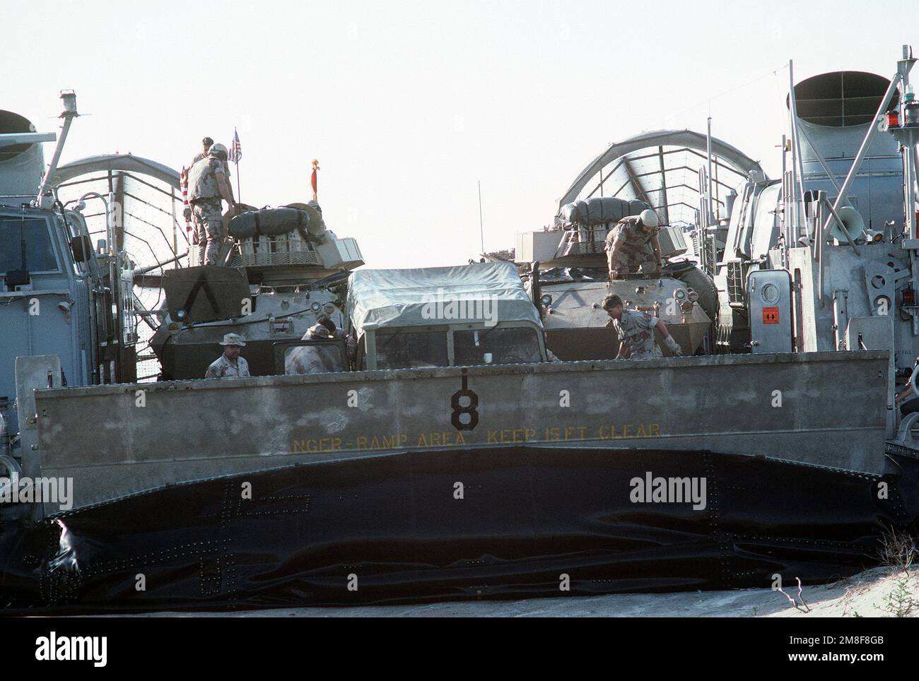 Marines from Company D, 2nd Light Armored Infantry Battalion, man their ...