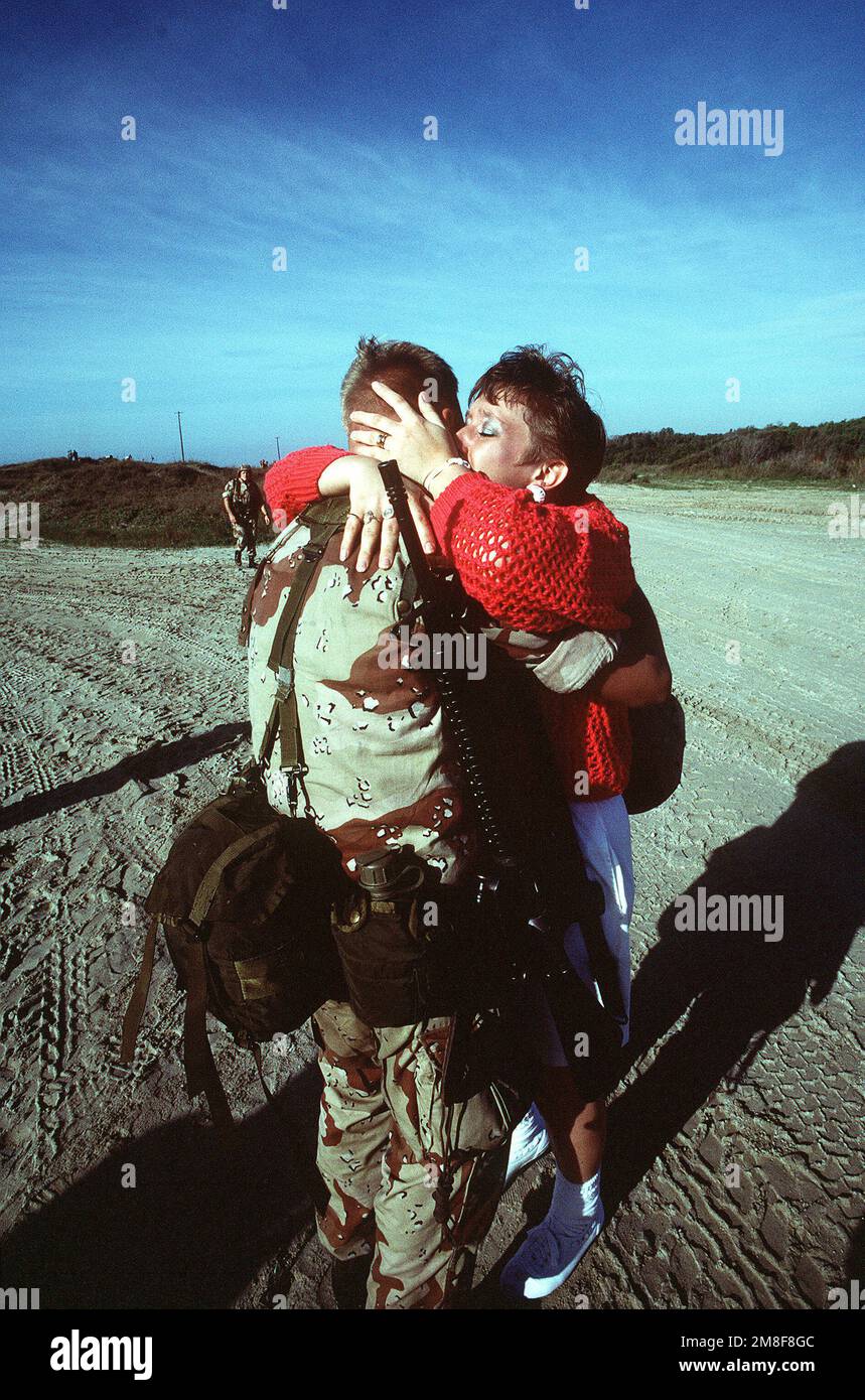 A Marine of the 4th Marine Expeditionary Brigade (4th MEB) is reunited ...