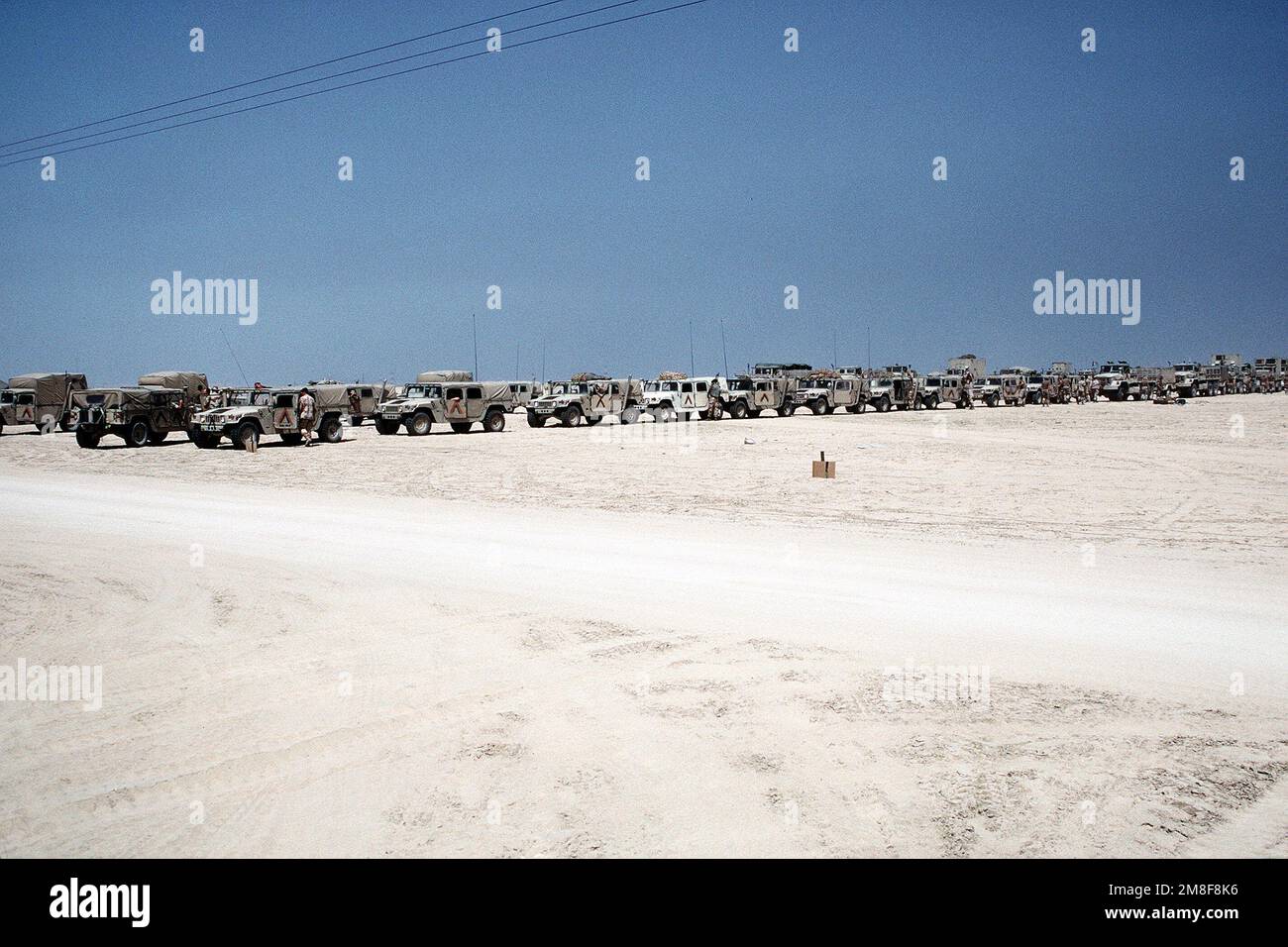 A convoy of M998 High-Mobility Multipurpose Wheeled Vehicles (HMMWV ...