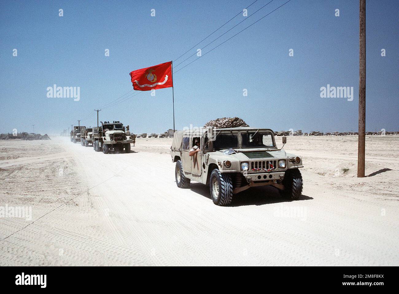 An M998 High-Mobility Multipurpose Wheeled Vehicle (HMMWV) leads a ...