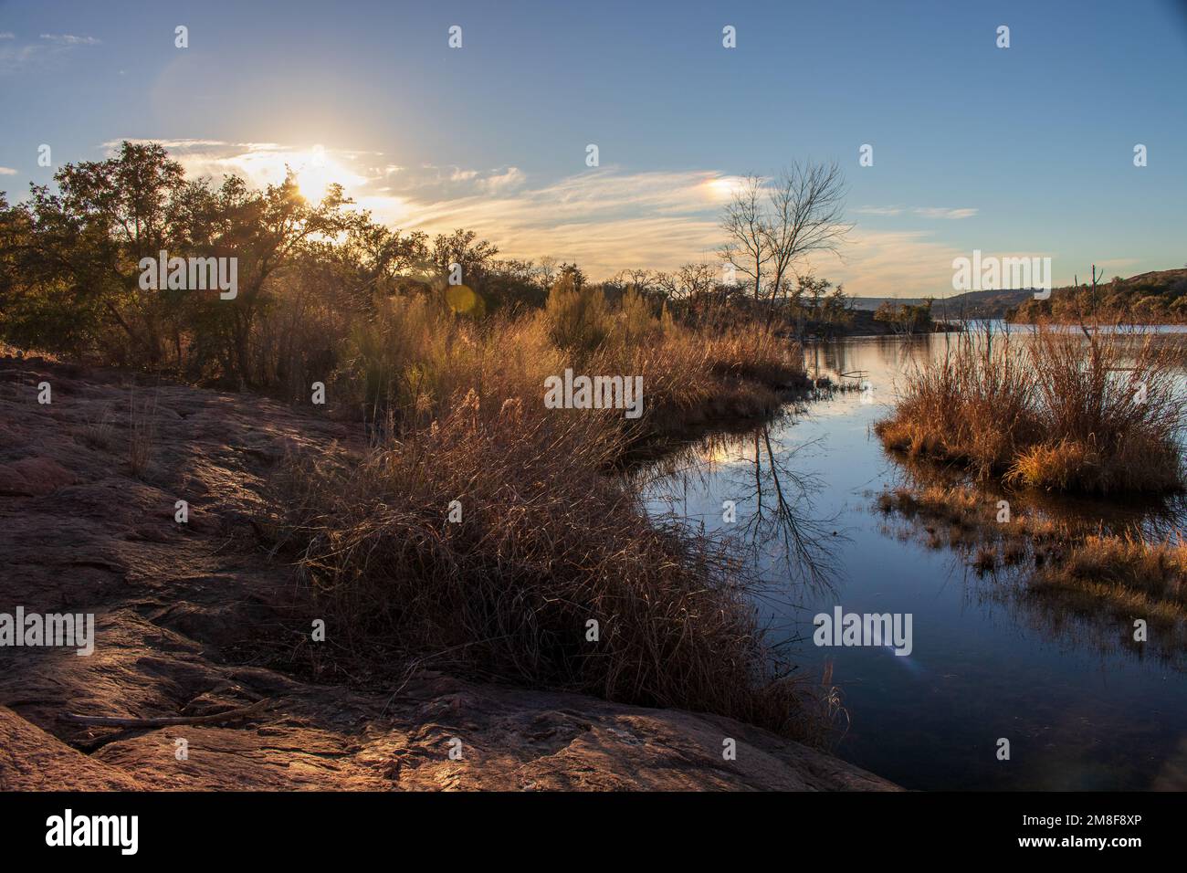 Texas Hill Country hiking trail with a view of Inks Lake. The ...