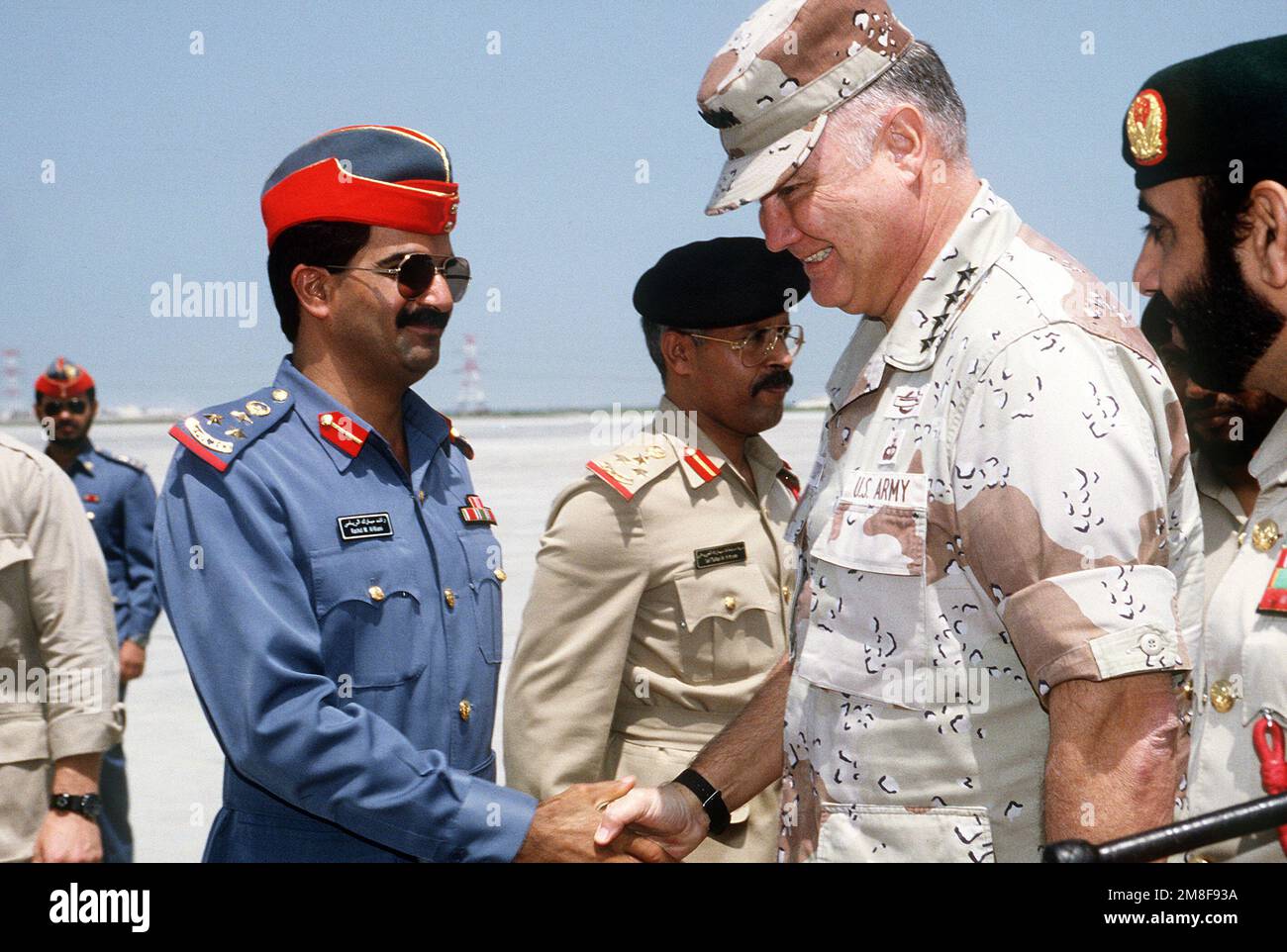An official of the U.A.E. armed forces greets GEN. Norman Schwarzkopf ...