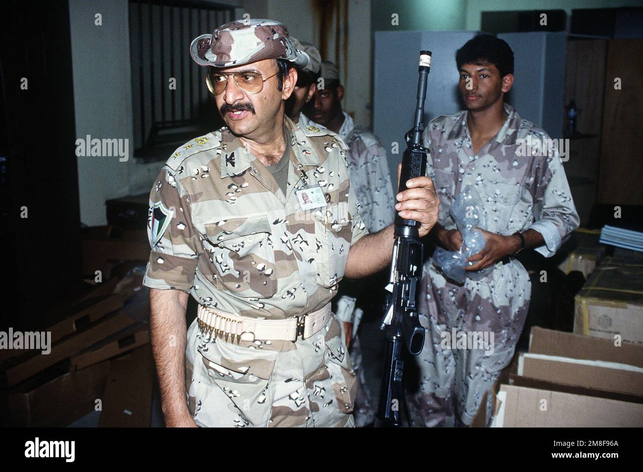 An officer of the Kuwaiti police force, armed with a 5.56mm M-4 Colt ...