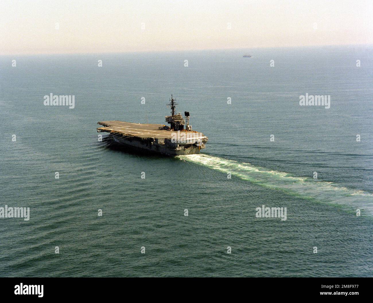 A port quarter view of the aircraft carrier USS KITTY HAWK (CV 63 ...