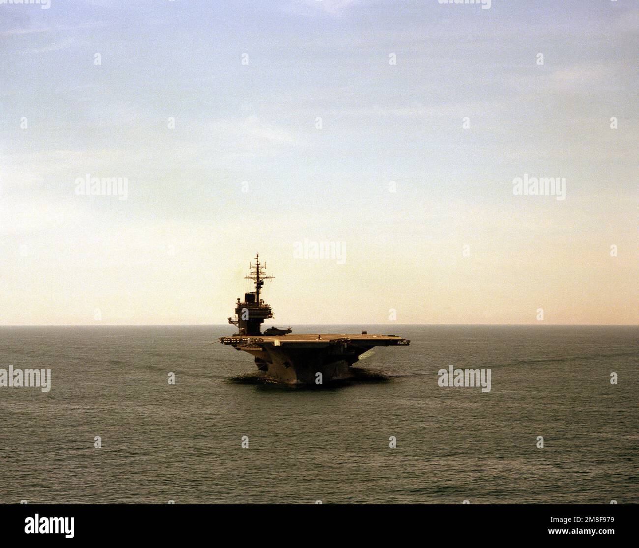 A bow view of the aircraft carrier USS KITTY HAWK (CV 63) underway ...