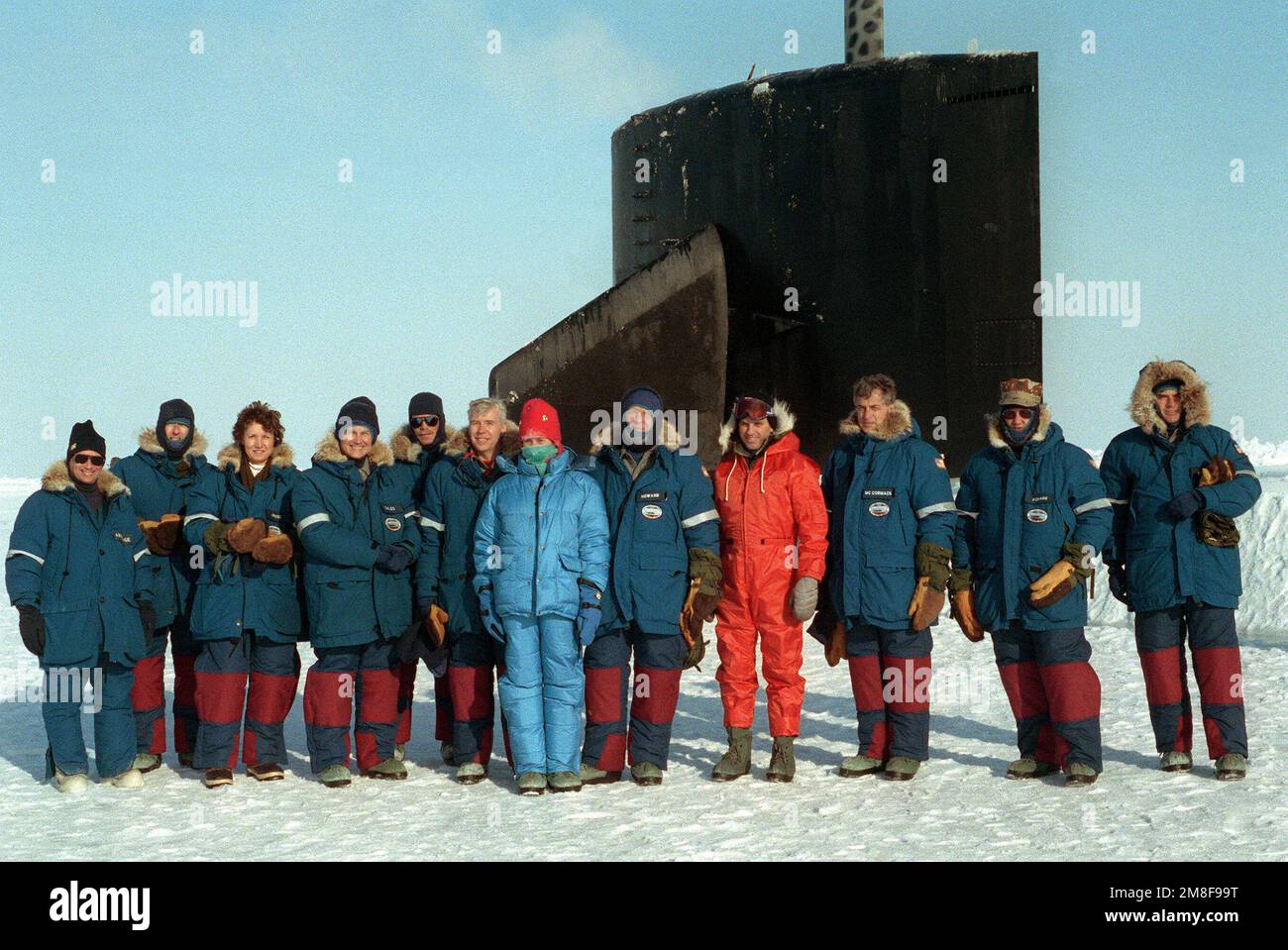 Standing in front of the nuclear-powered attack submarine USS PARGO ...