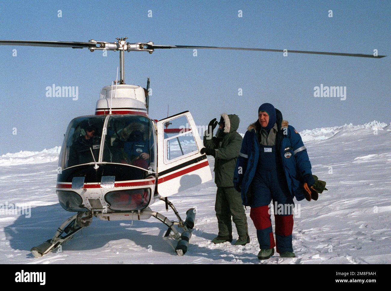 Undersecretary of the Navy Daniel Howard walks away from a chartered ...