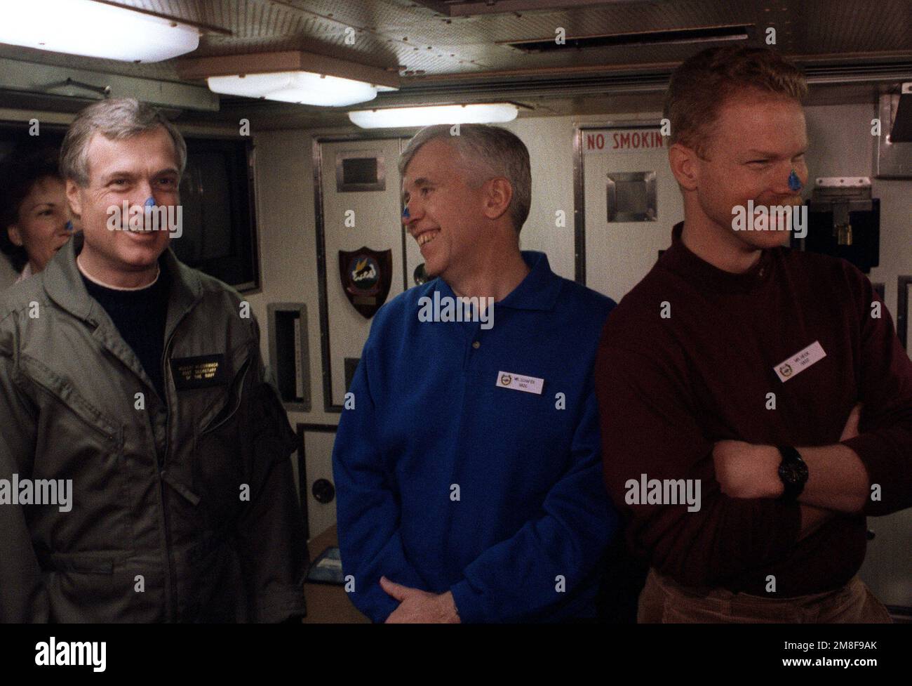 Robert McCormack, front left, assistant secretary of the Navy for ...