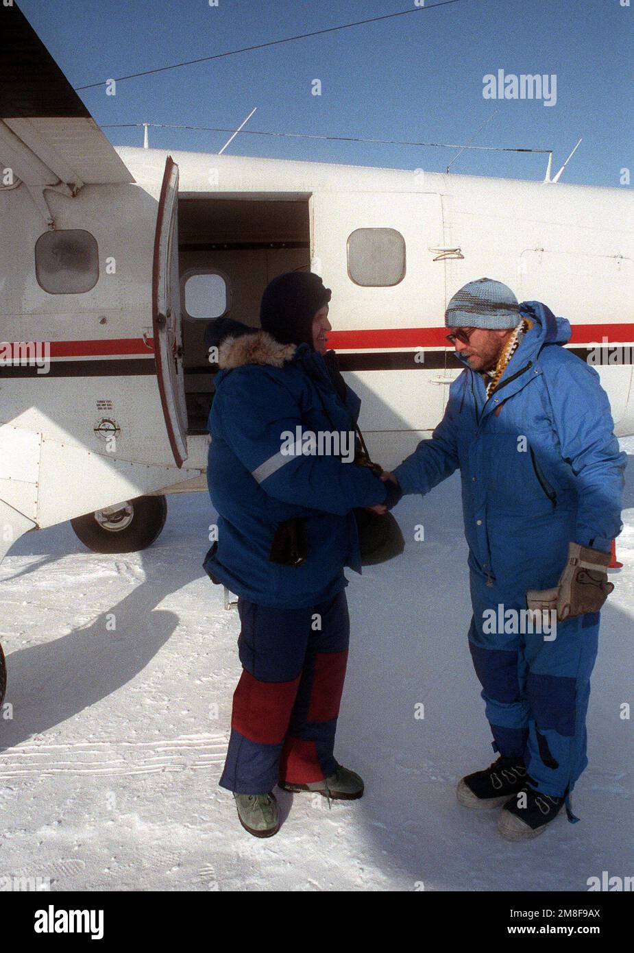 Undersecretary of the Navy Daniel Howard, left, thanks the pilot of the ...
