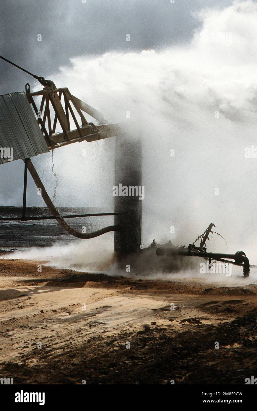 Firefighters from the Boots and Coots Oil Well Firefighting Company ...