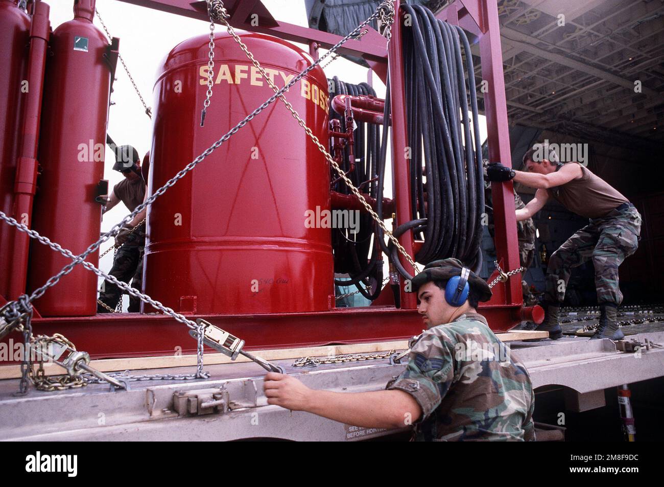 Members of the 301st Military Airlift Squadron secure firefighting ...
