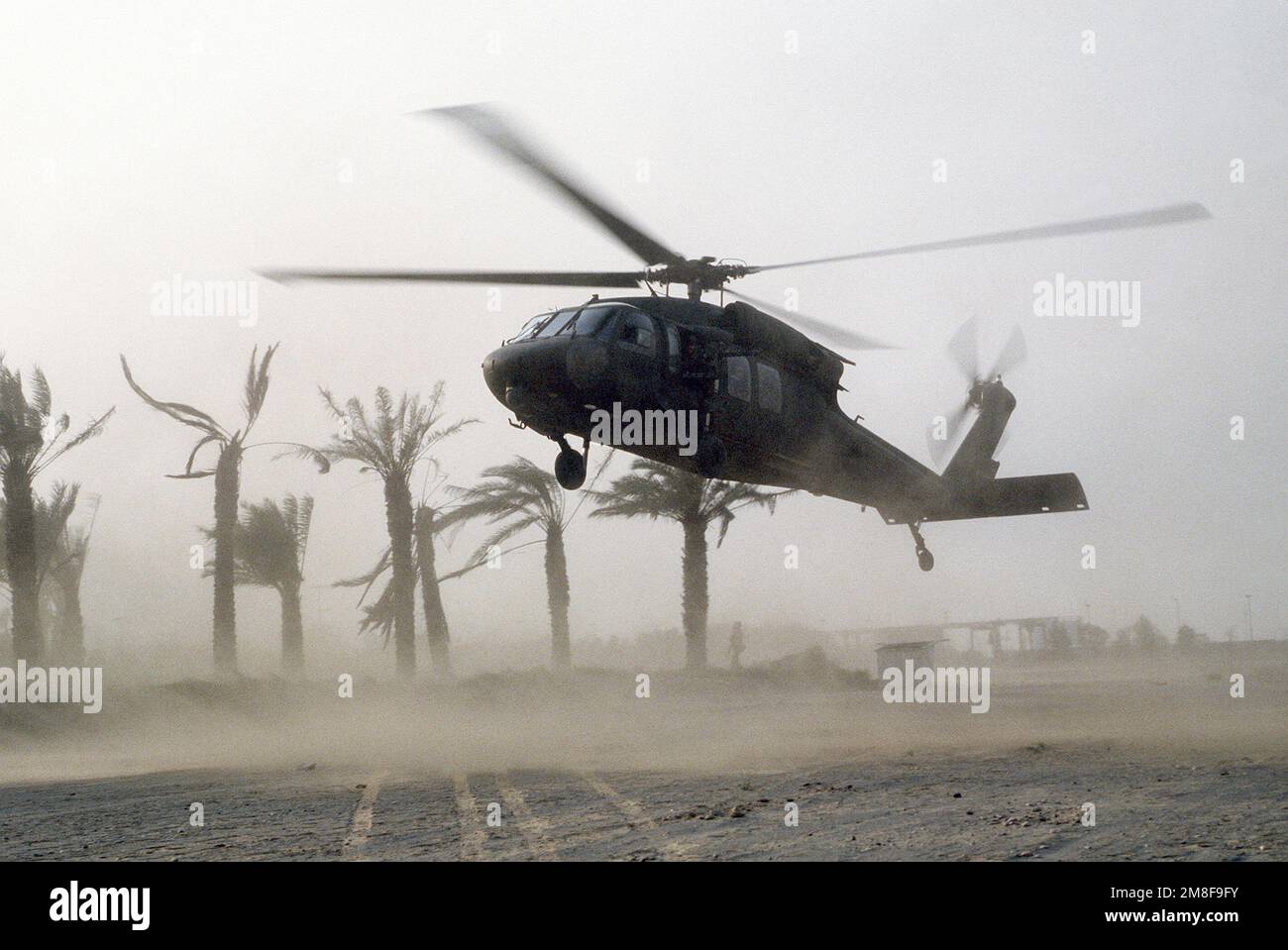 A UH-60 Black Hawk (Blackhawk) helicopter transporting GEN. Norman ...
