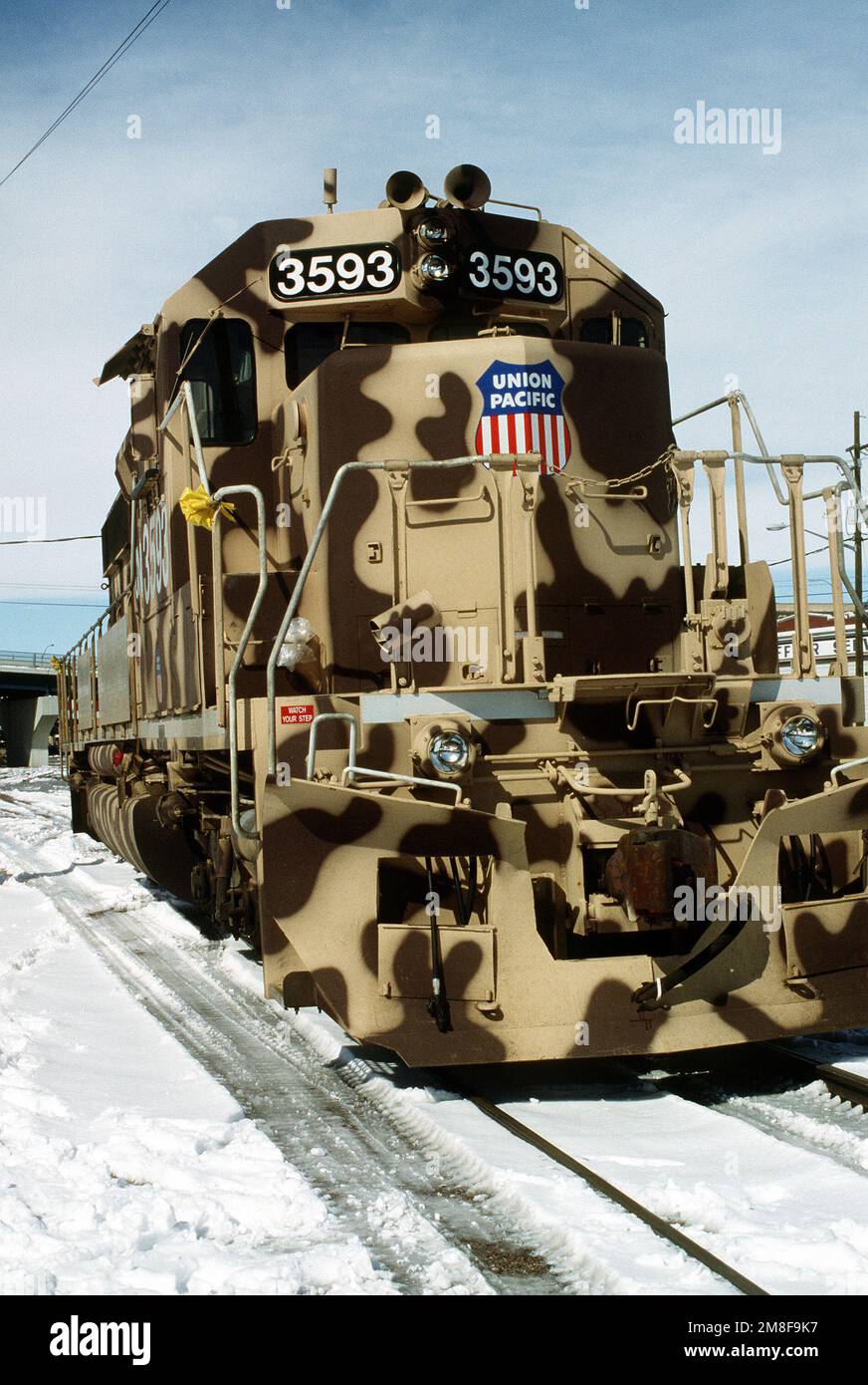 An SD40-2 locomotive nicknamed "Desert Victory" wears a camouflage ...