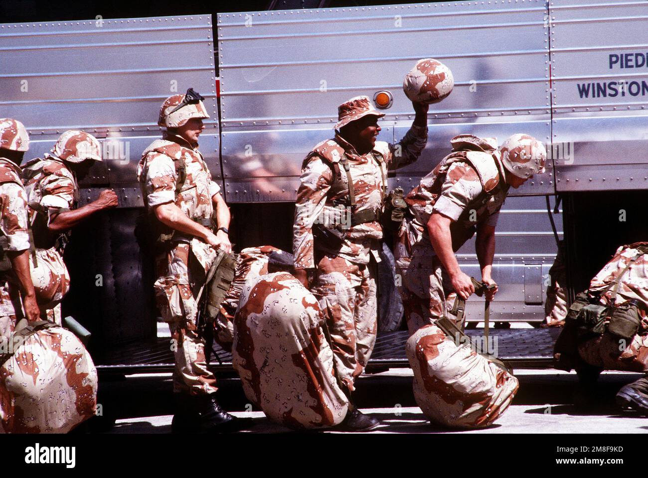 Marines from the 4th Marine Expeditionary Brigade (4th MEB) load their ...