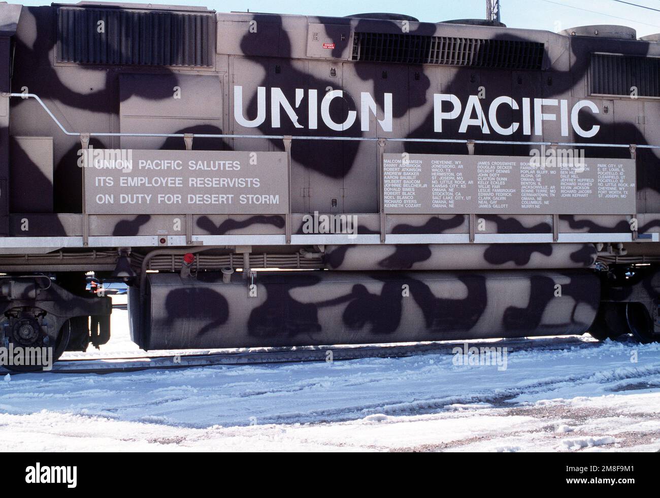 An SD40-2 locomotive nicknamed "Desert Victory" wears a camouflage ...