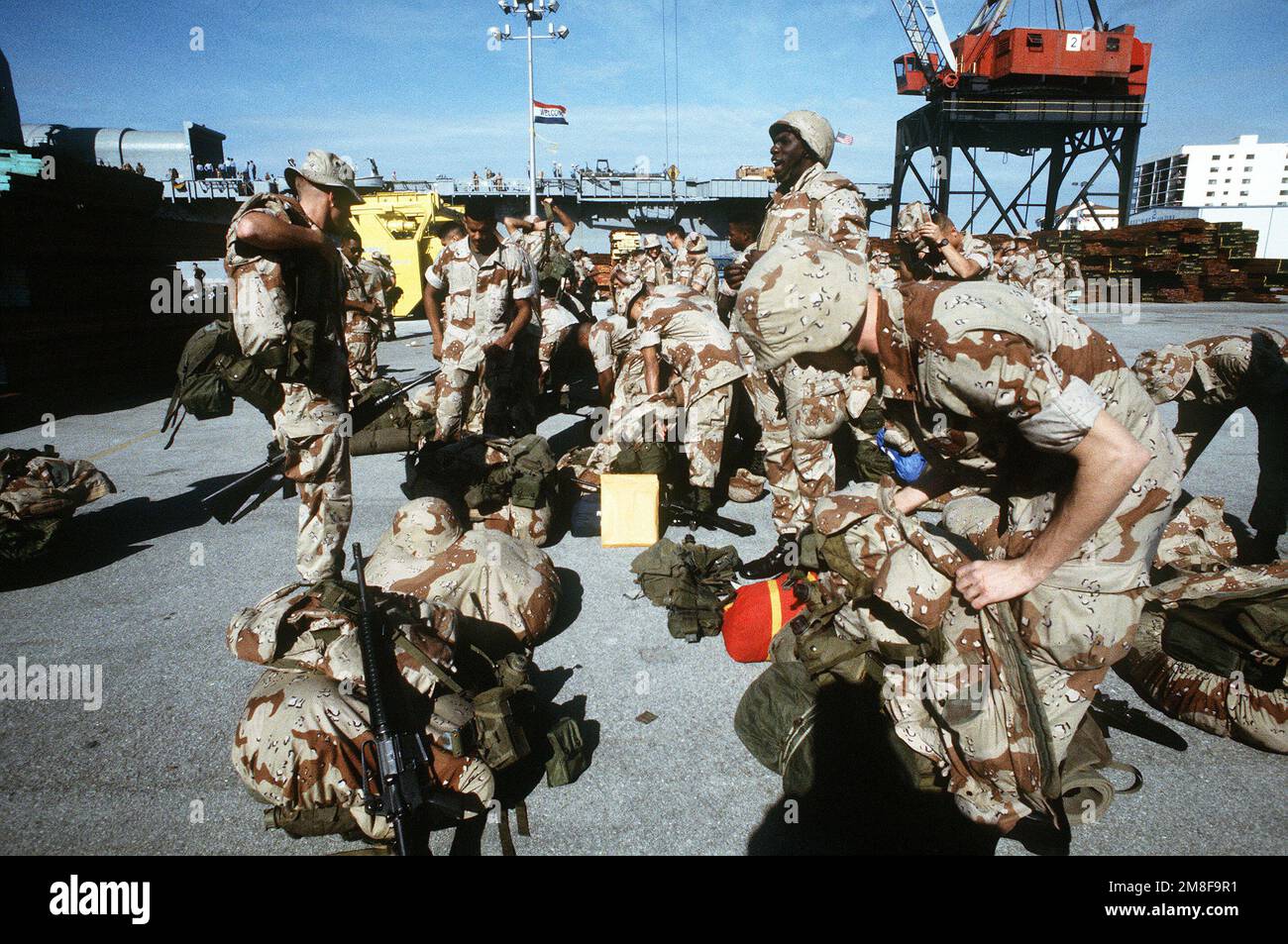 Marines from the 4th Marine Expeditionary Brigade (4th MEB) gather up ...