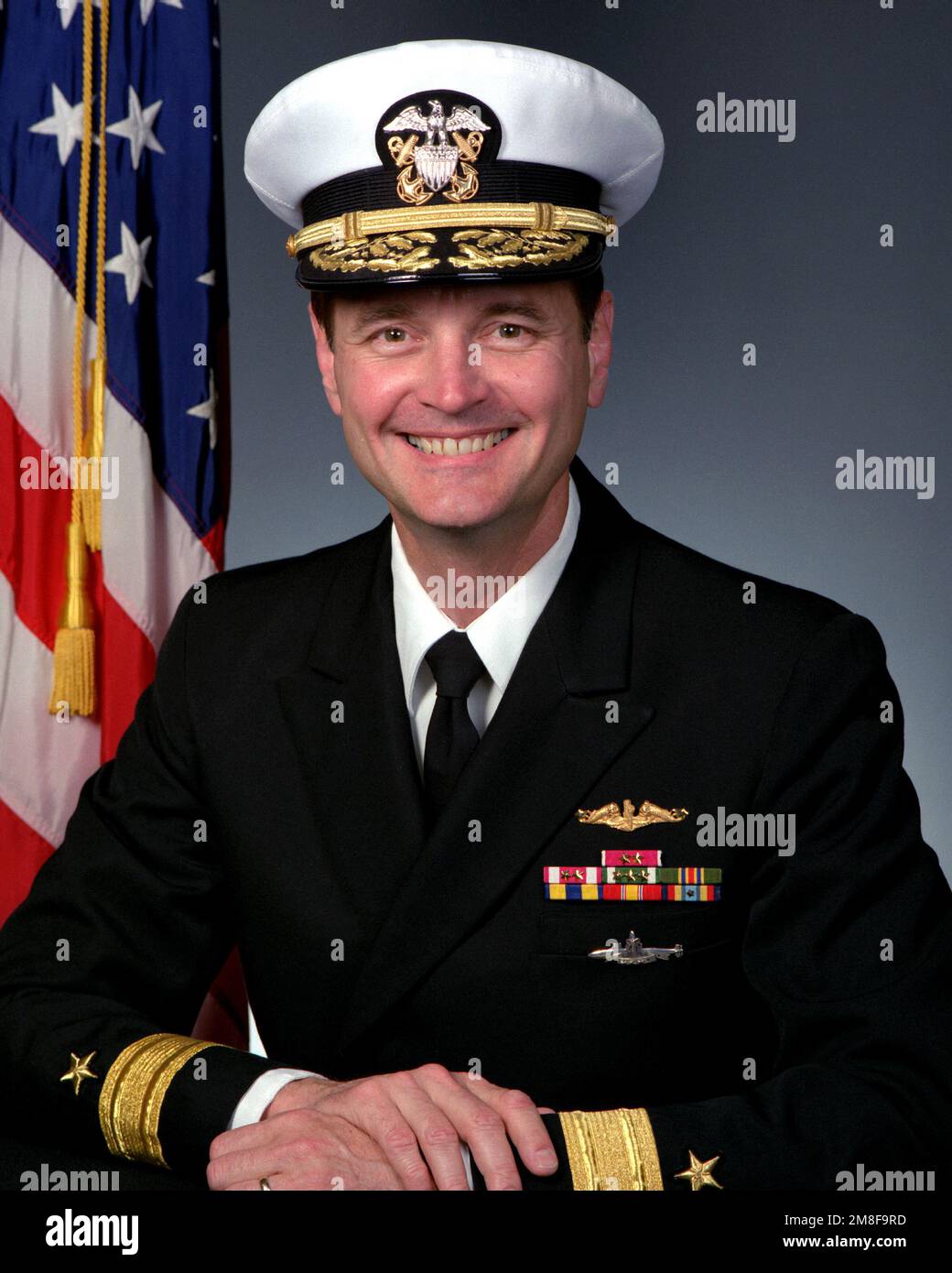 Rear Adm. (lower half) Richard A. Riddell, USN (covered). Country ...