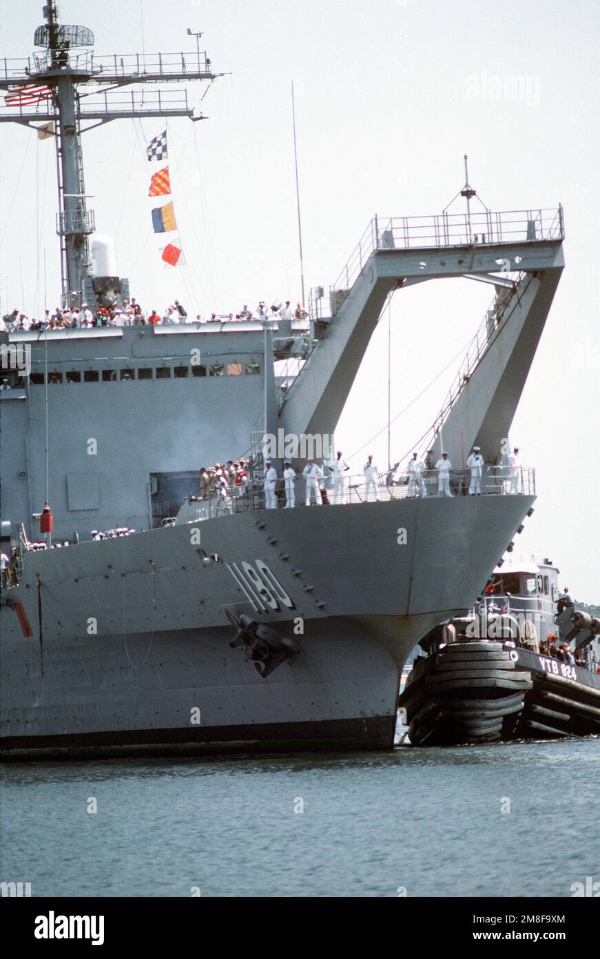 The large harbor tug SANTAQUIN (YTB-824) assists the tank landing ship ...