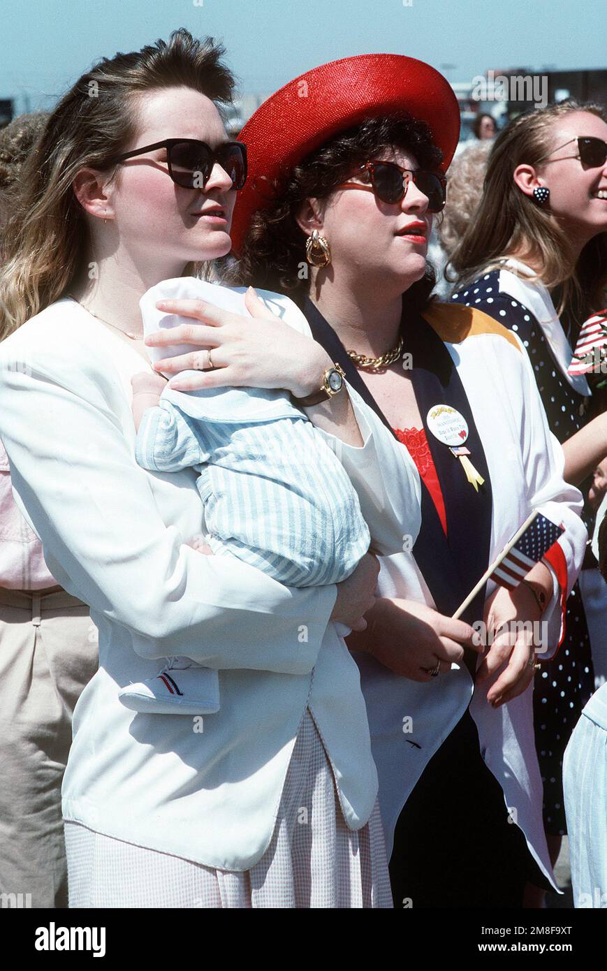 Two wives of two sailors assigned to the tank landing ship USS ...