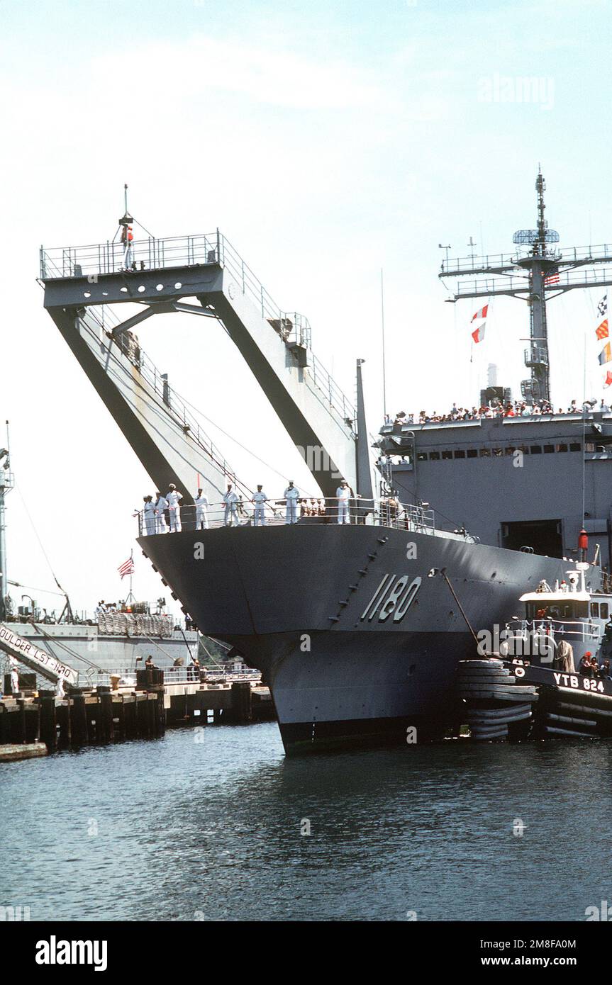 The large harbor tug SANTAQUIN (YTB-824) moves the tank landing ship ...