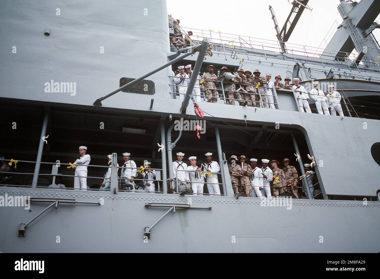 Sailors and Marines aboard the amphibious cargo ship USS DURHAM (LKA ...