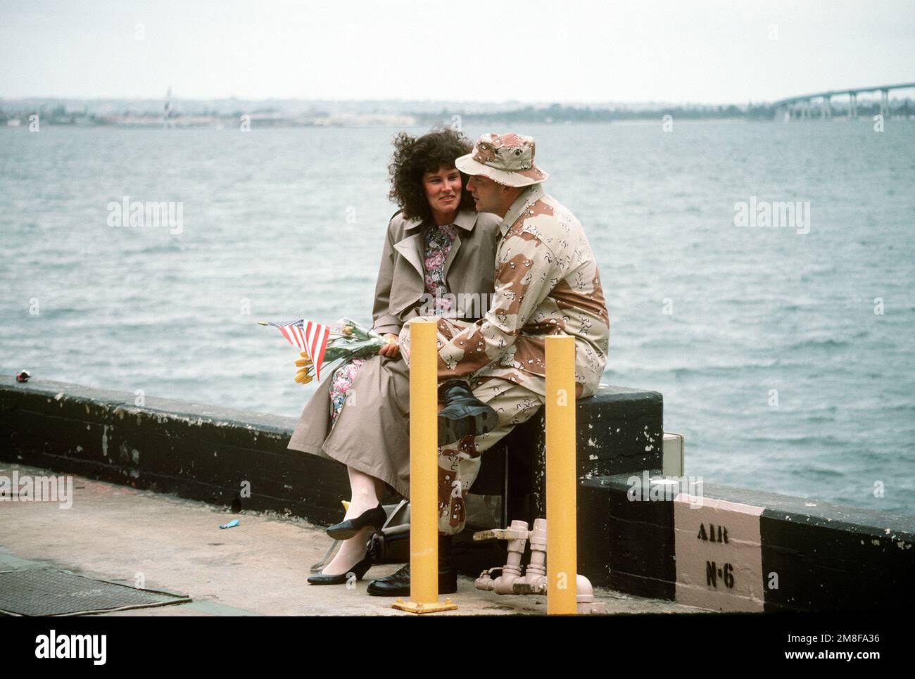 A Marine is reunited with a loved one following his arrival in port ...