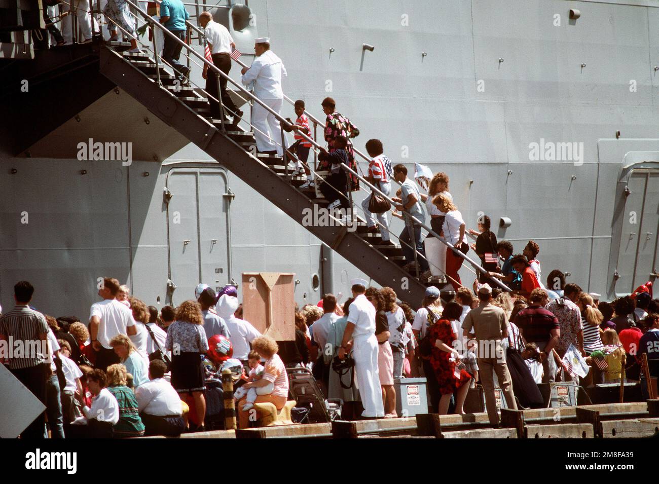 Family members and friends climb up the accommodation ladder to go ...