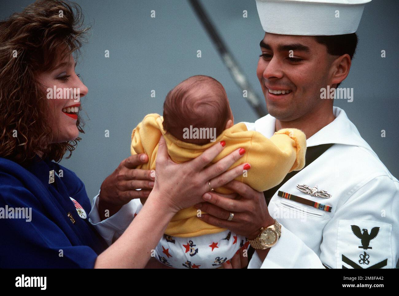 A crew member from the amphibious cargo ship USS DURHAM (LKA-114) is ...