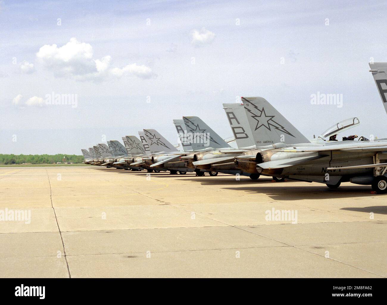 Fighter Squadron 33 (VF-33) F-14A Tomcat aircraft are parked on the ...