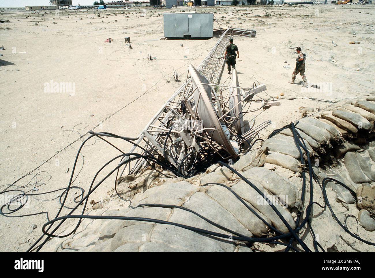 A satellite communications station lies in ruins in the aftermath of ...