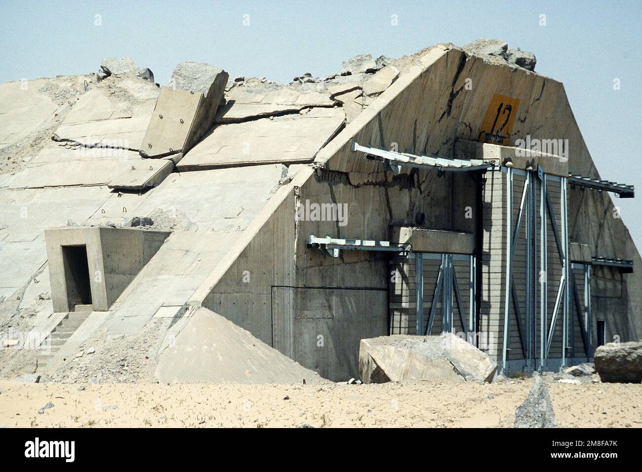 A hardened aircraft shelter at Ali Al Salem Air Base, damaged during ...