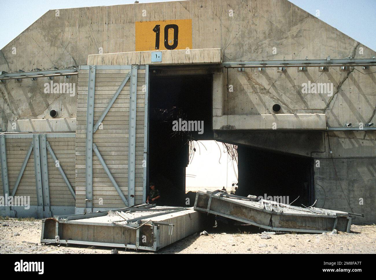 A hardened aircraft shelter at Ali Al Salem Air Base, damaged during ...