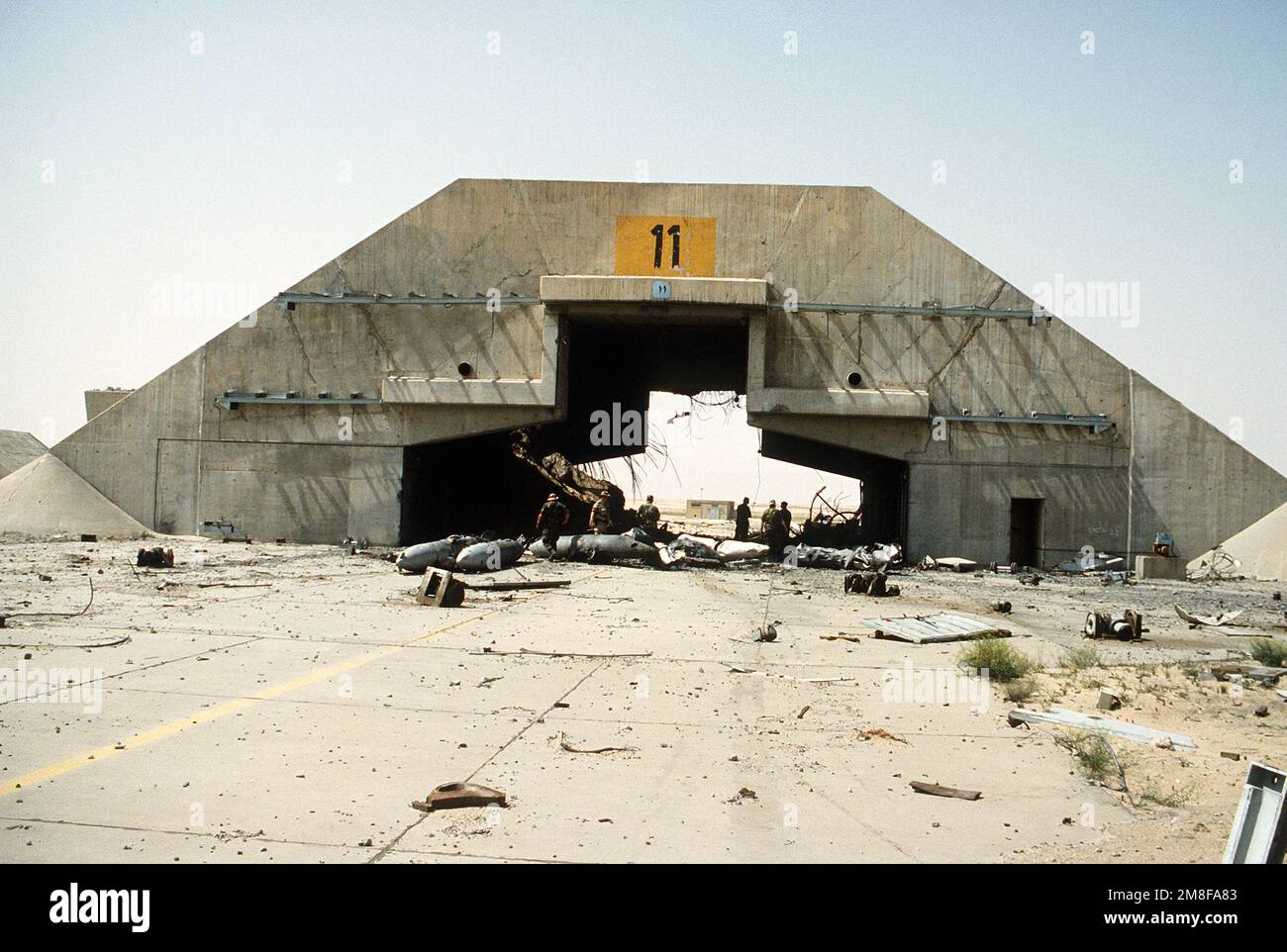 A hardened aircraft shelter at Ali Al Salem Air Base, damaged during ...