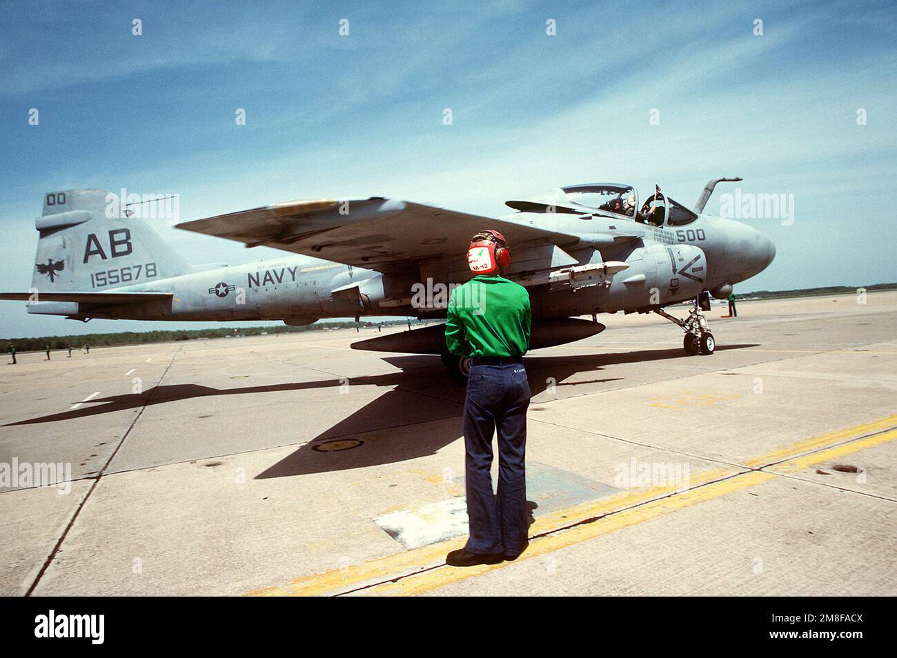 A plane captain from Attack Squadron 42 (VA-42) watches as an Attack ...