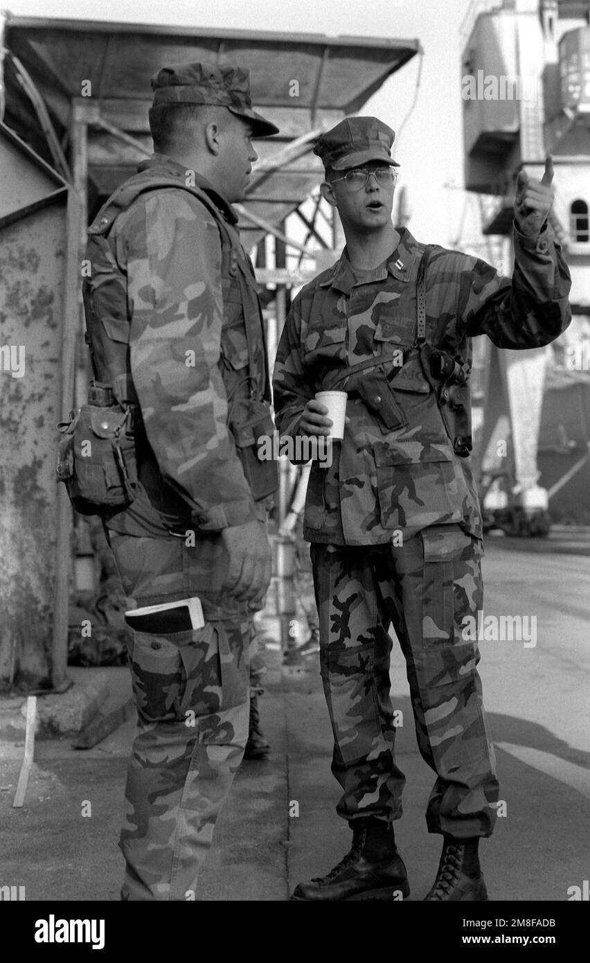 A captain from the 24th Marine Expeditionary Unit (24th MEU) talks to ...