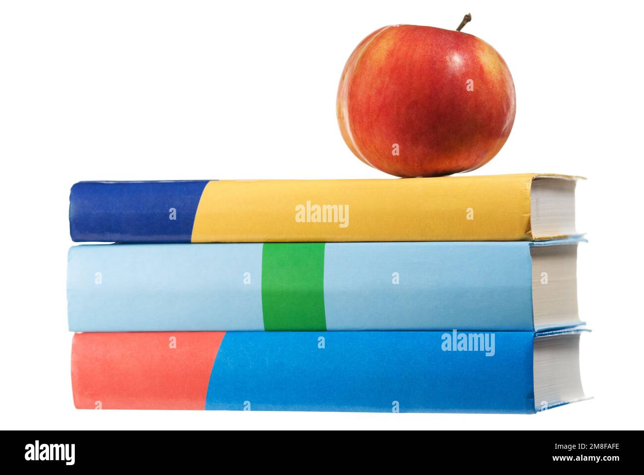 A stack of books with apple on white Stock Photo - Alamy