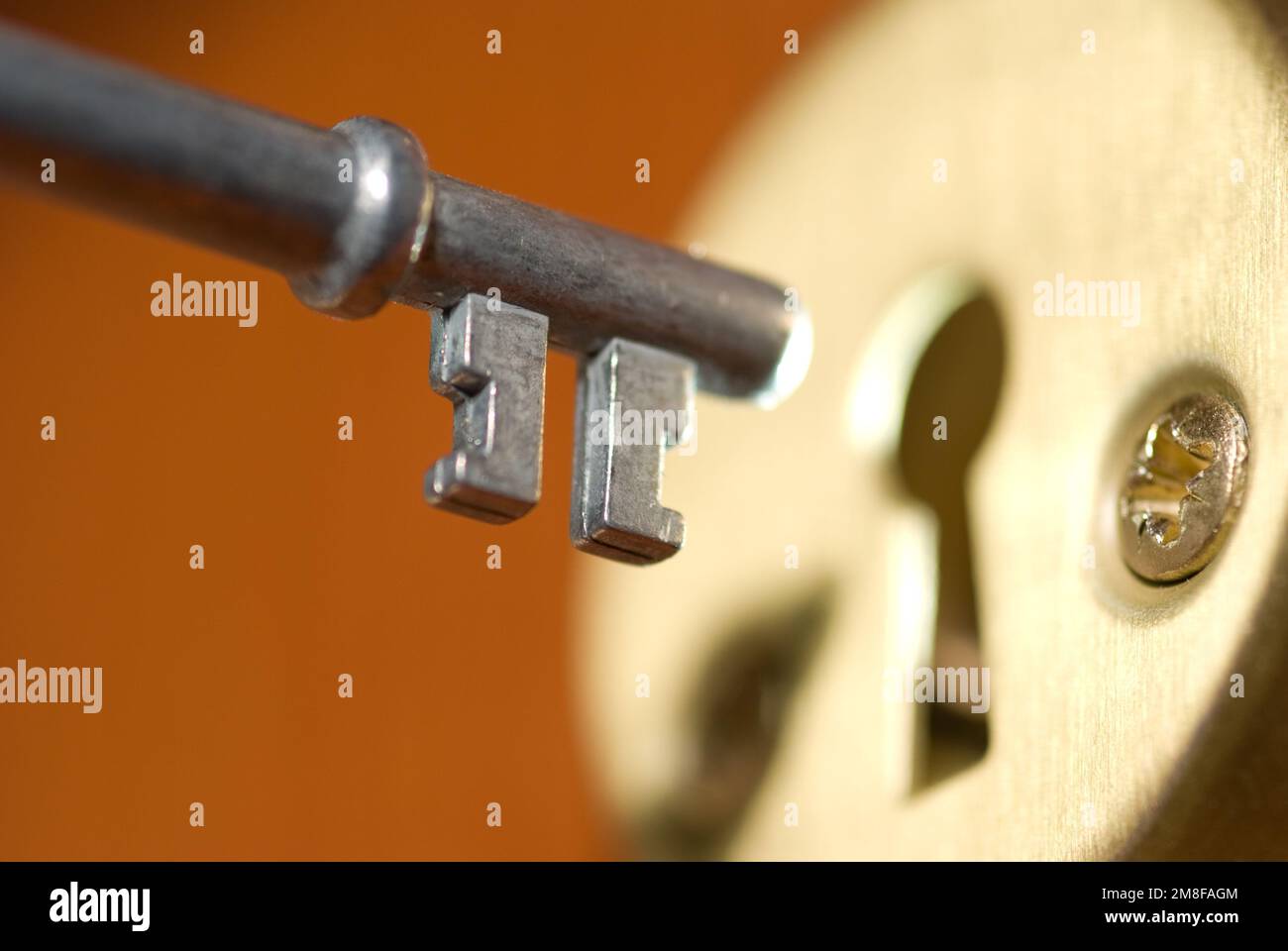 Key and door lock keyhole Stock Photo - Alamy