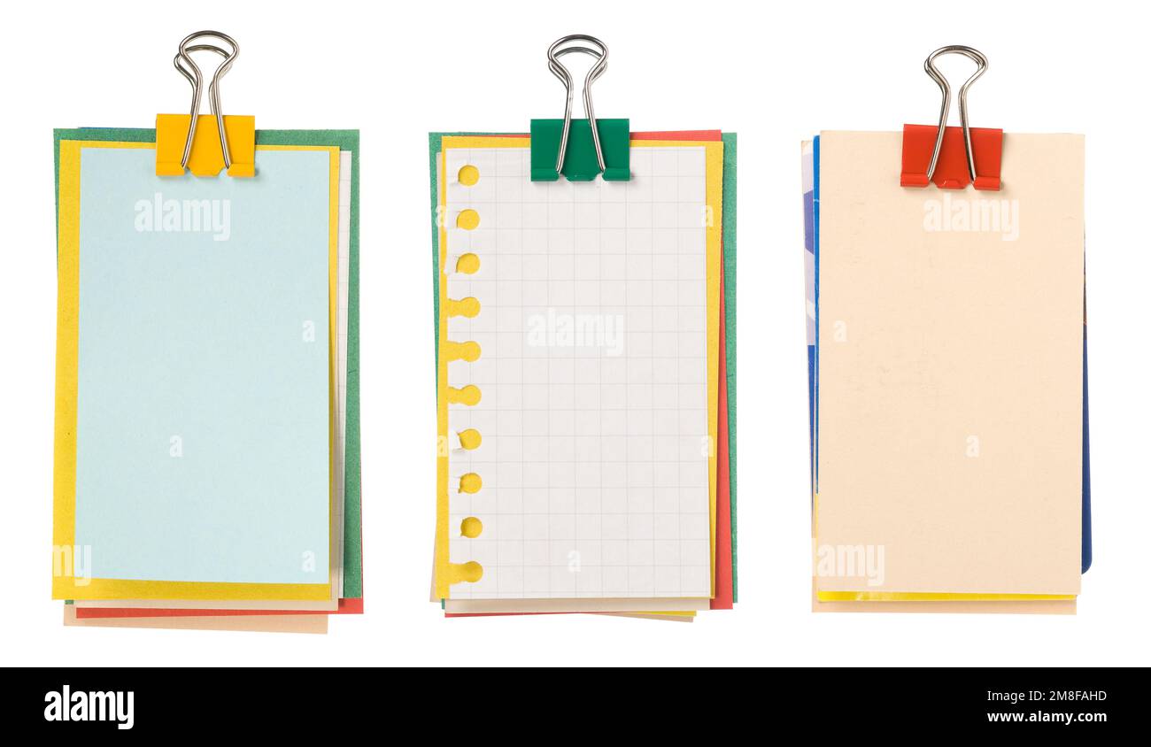 Three bundles of paper with a clip isolated on white Stock Photo - Alamy