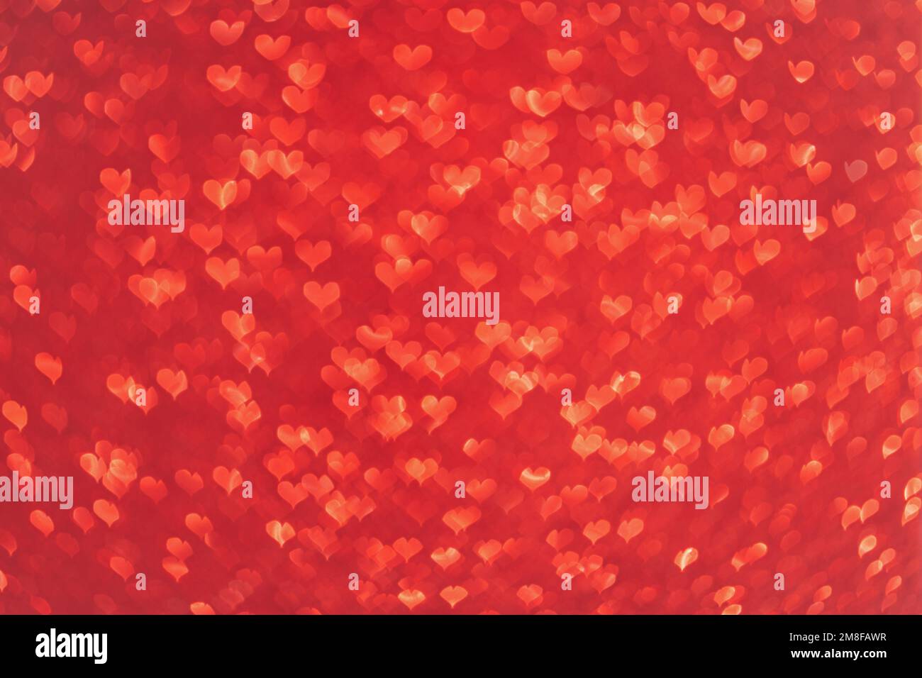 Red background with heart shaped highlights Stock Photo - Alamy