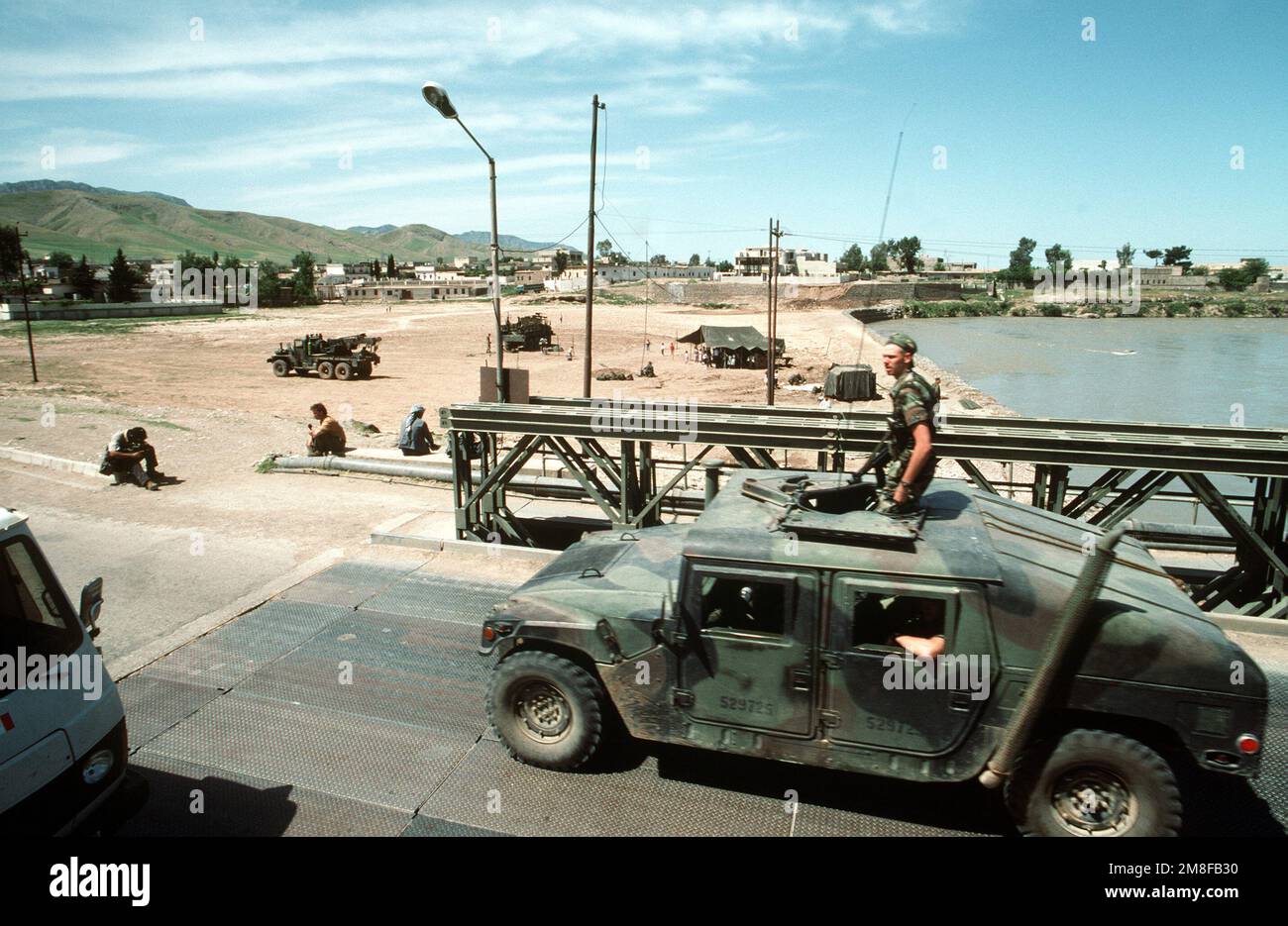 An M998 High-Mobility Multipurpose Wheeled Vehicle (HMMWV) carrying U.S ...