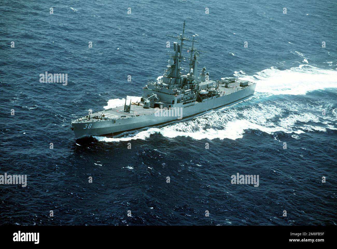 A port bow view of the nuclear-powered guided missile cruiser USS ...