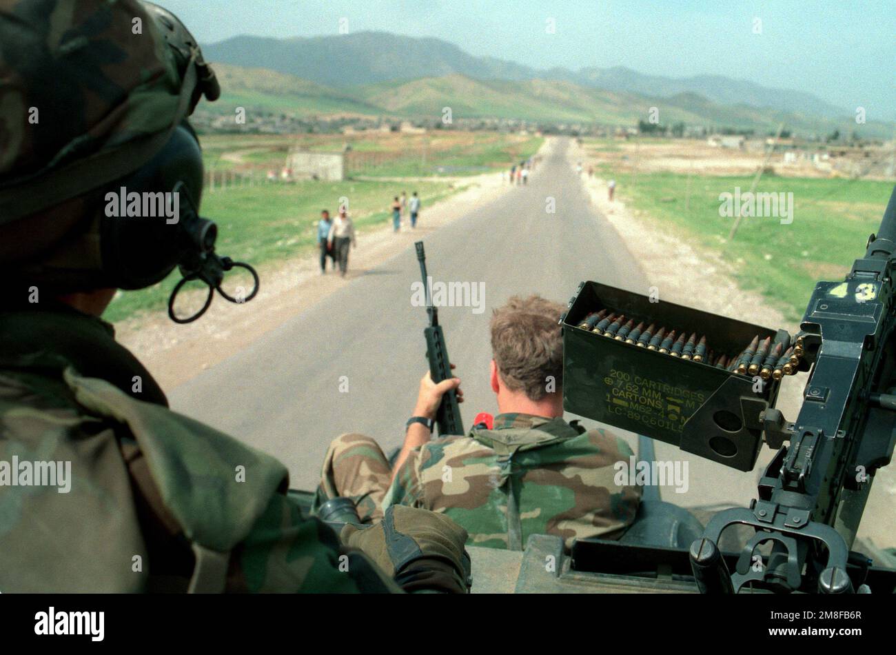 Marines ride atop an LAV-25 light armored vehicle while on patrol in ...