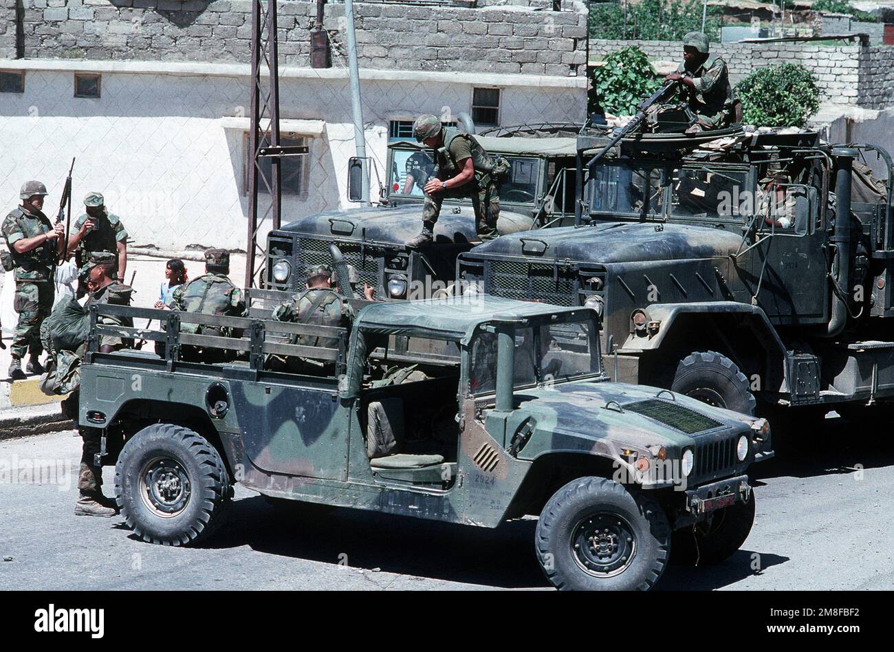 Marines prepare to move out in an M998 High-Mobility Multipurpose ...