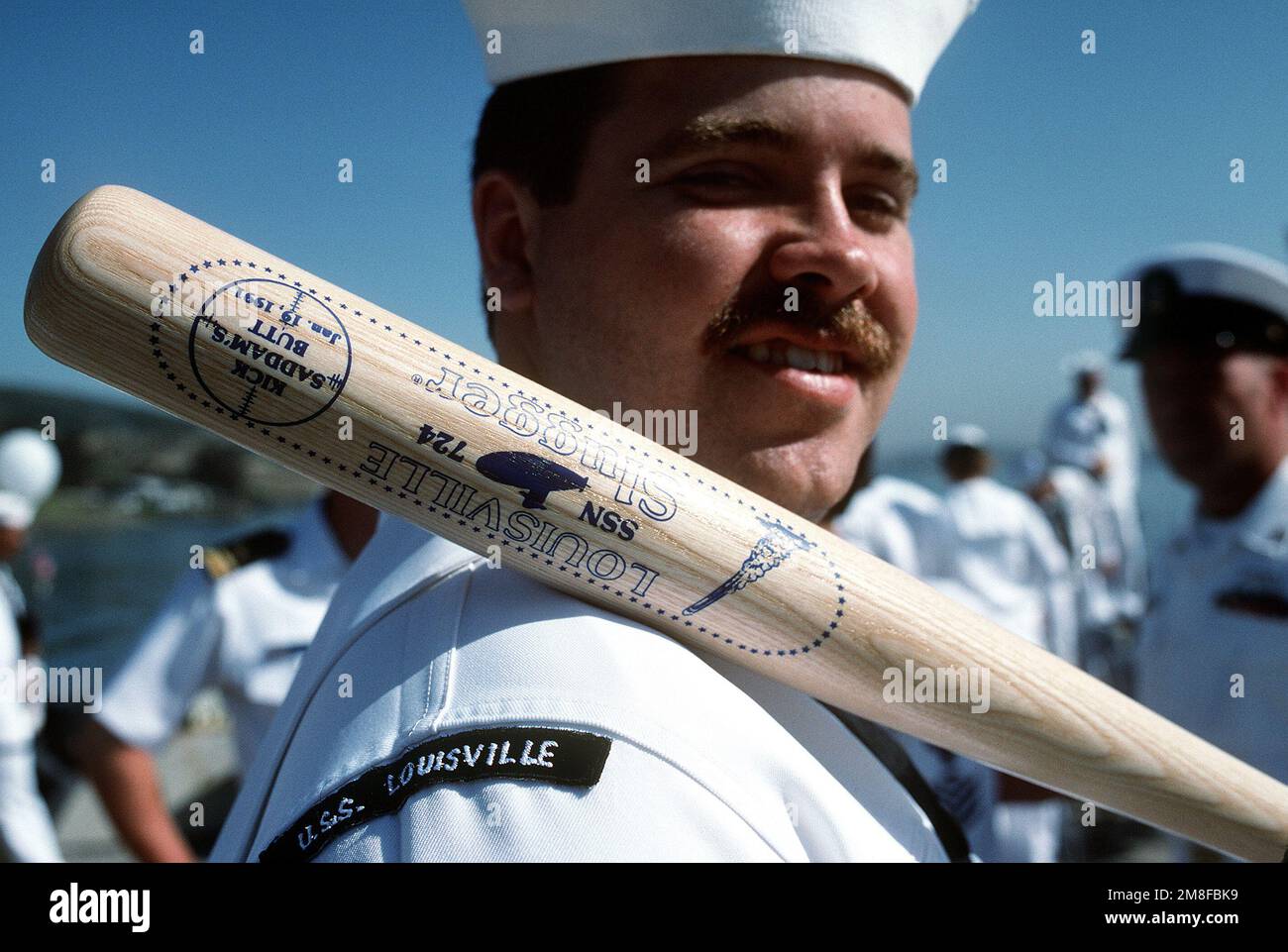 A sailor assigned to the nuclear-powered attack submarine USS ...