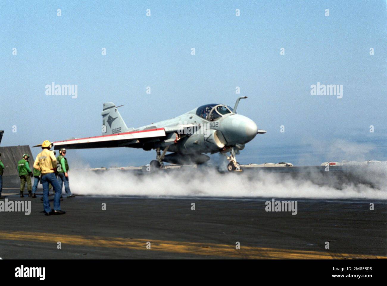 A catapult crew on the nuclear-powered aircraft carrier USS THEODORE ...