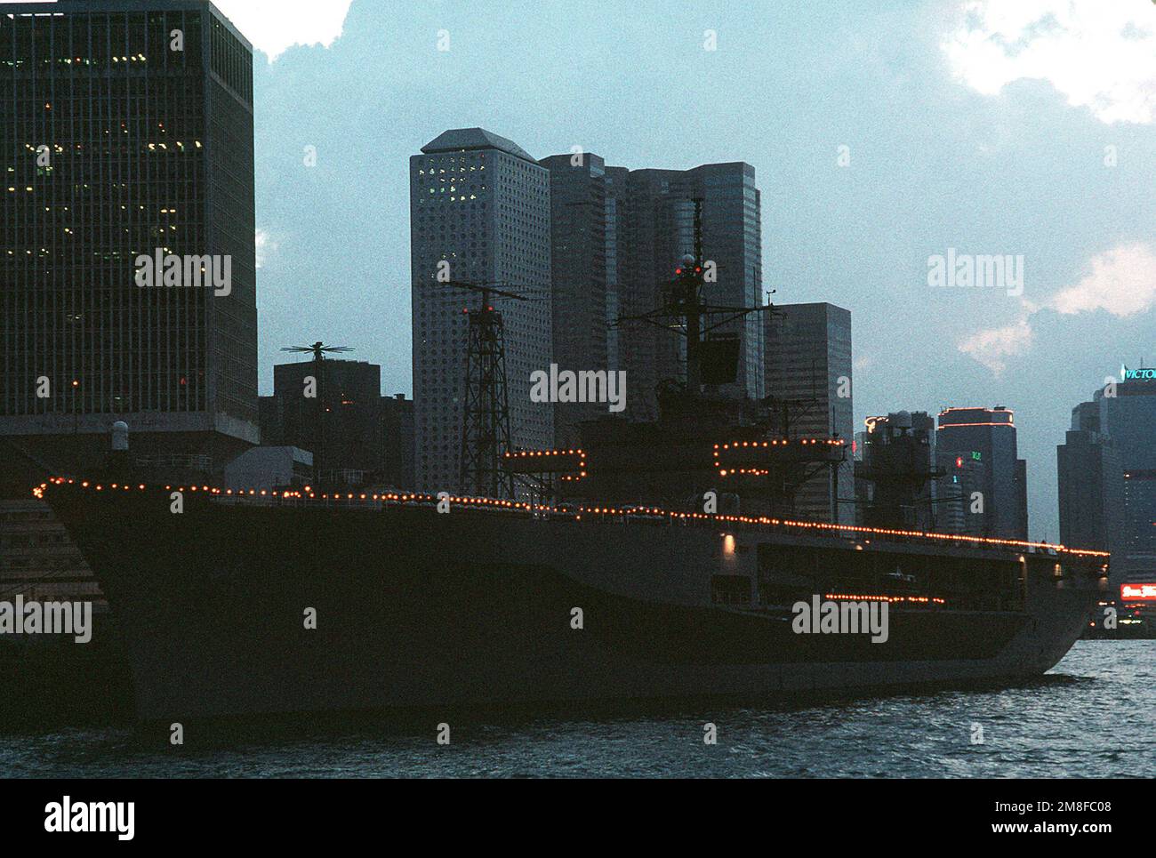 Lights bedeck the amphibious command ship USS BLUE RIDGE (LCC-19) as ...