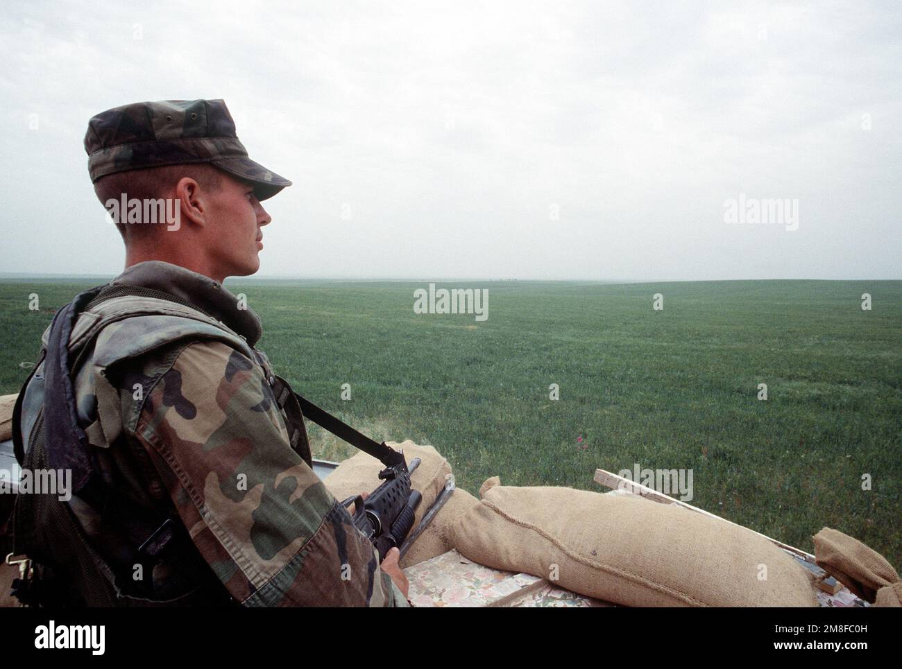 LCPL Ed Misker of Co. H, 2nd Bn., 8th Marine Regiment stands watch in a ...