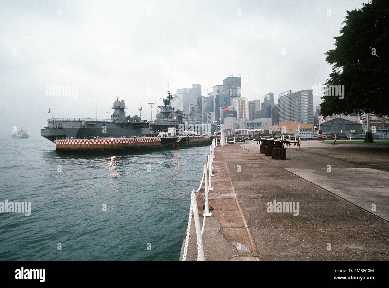 The amphibious command ship USS BLUE RIDGE (LCC-19) is moored to a pier ...