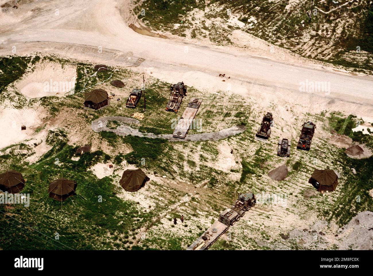 An aerial view of the camp and some of the equipment of members of ...